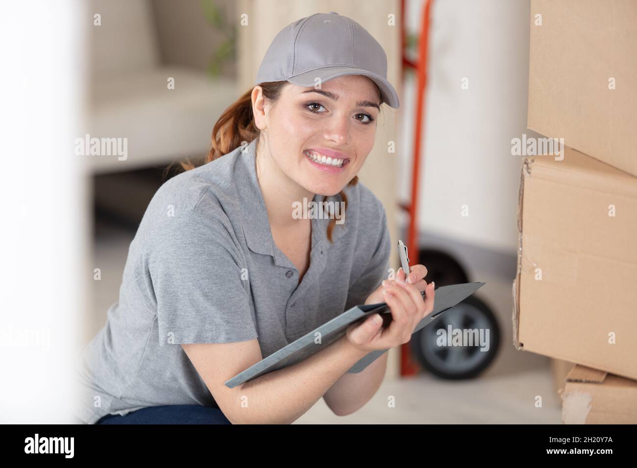portrait of a happy delivery woman Stock Photo - Alamy