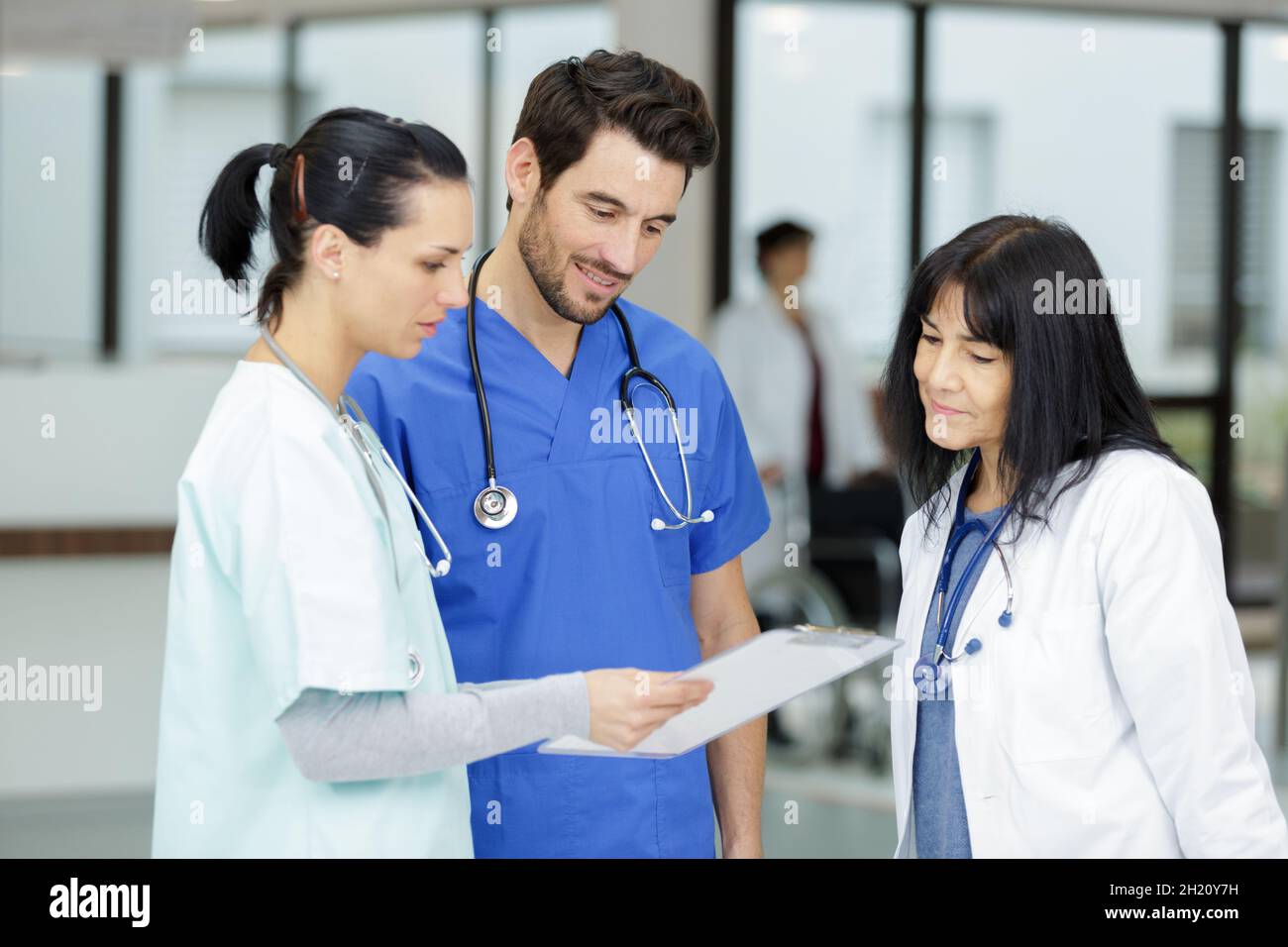 Three hospital workers smiling hi-res stock photography and images - Alamy