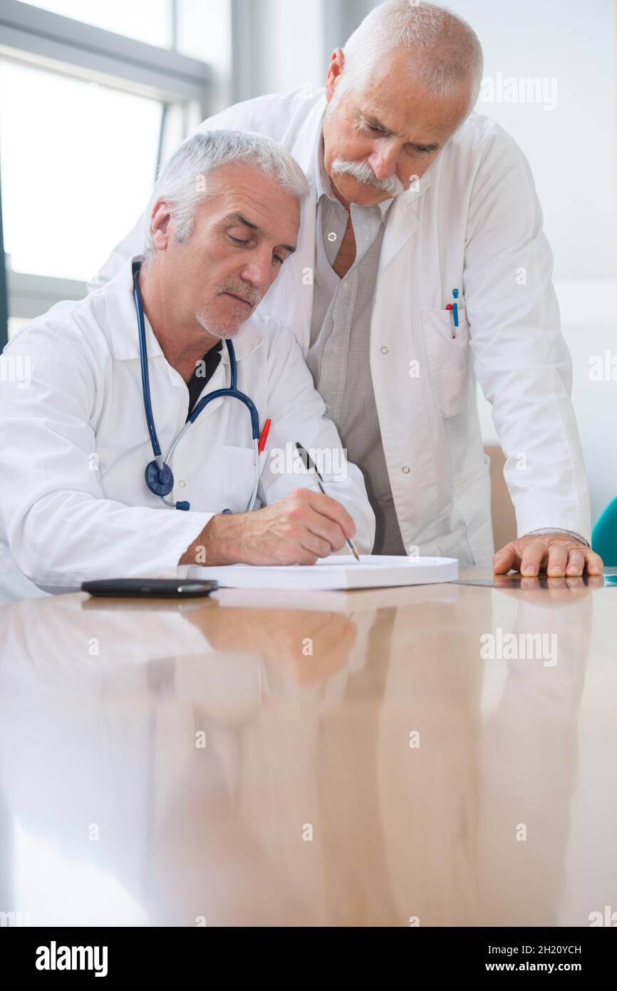 senior doctors checking report at hospital Stock Photo - Alamy