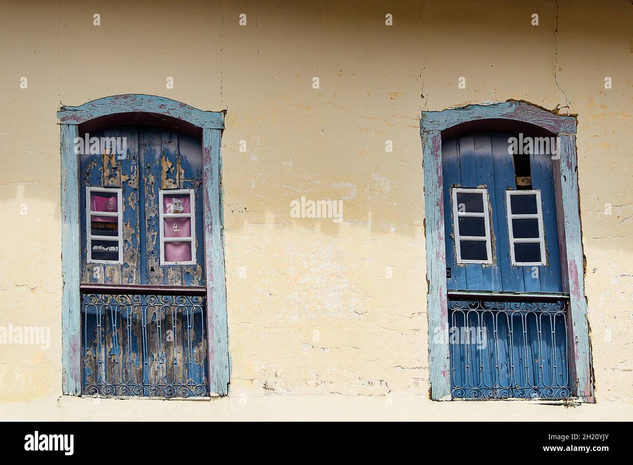 Two colonial-style windows in a house in the city of Goiás Stock Photo ...