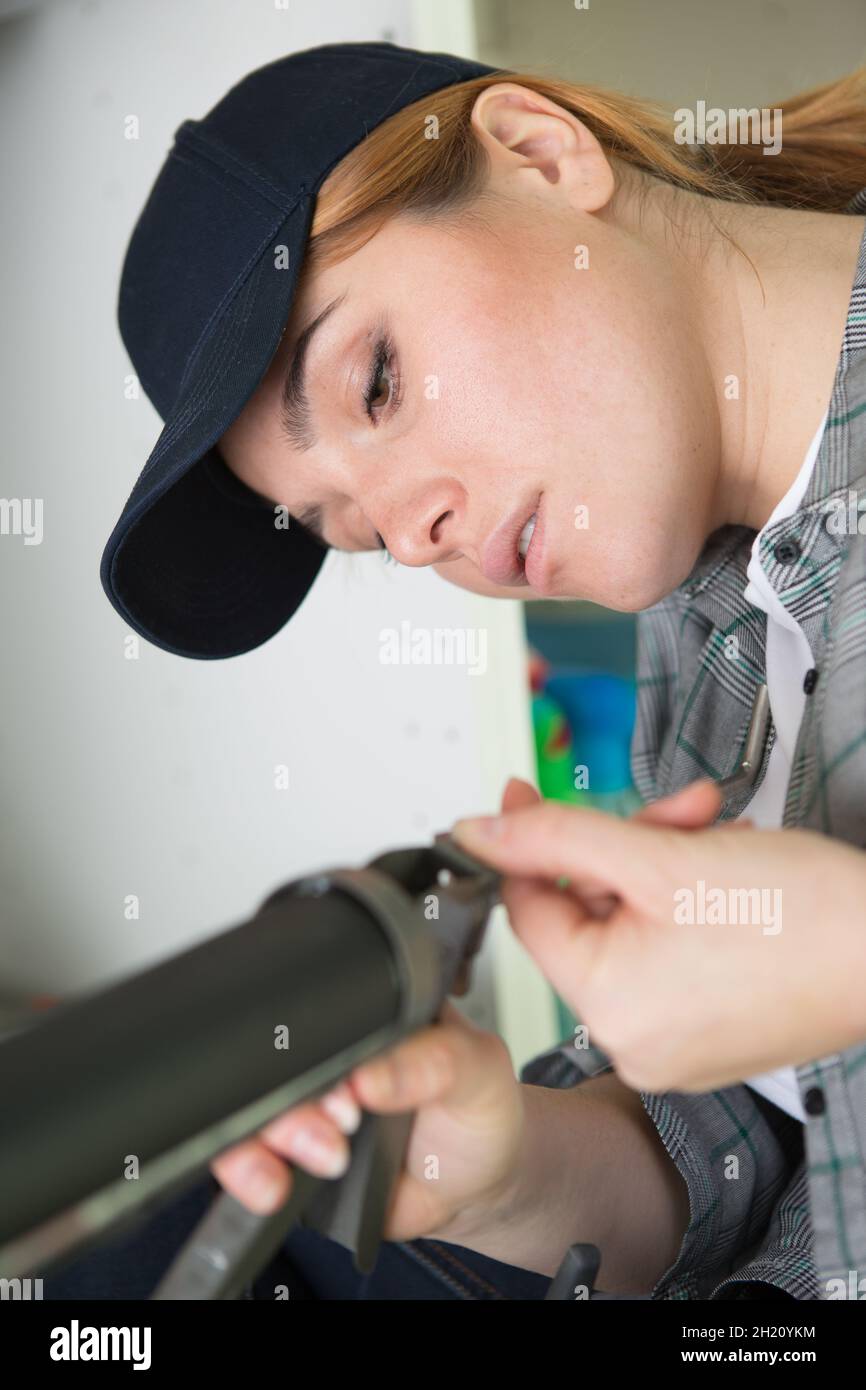 the woman is repairing the radiator Stock Photo - Alamy
