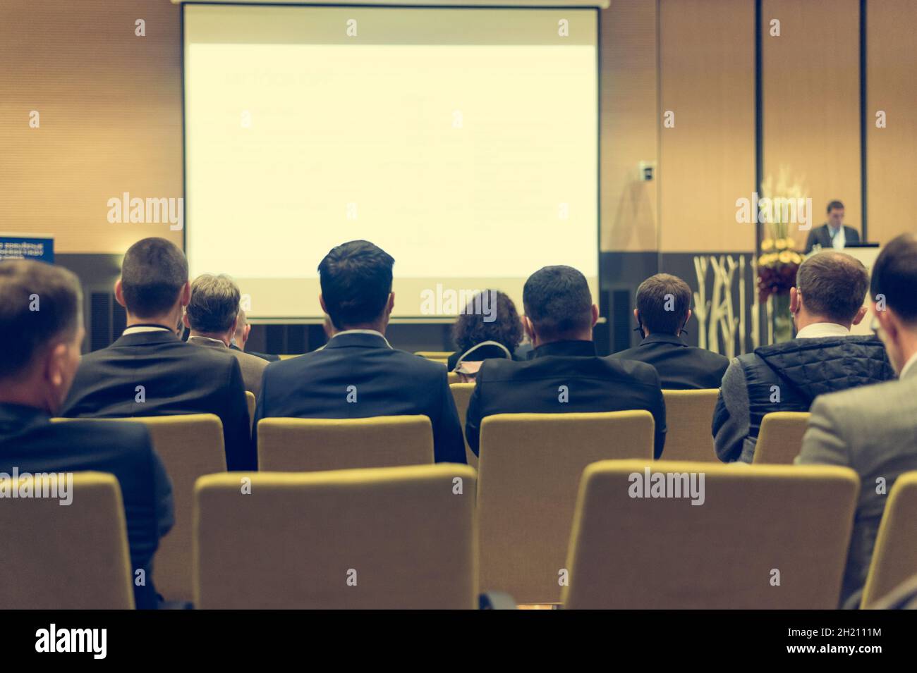 Speaker giving a talk in conference hall at business meeting event ...