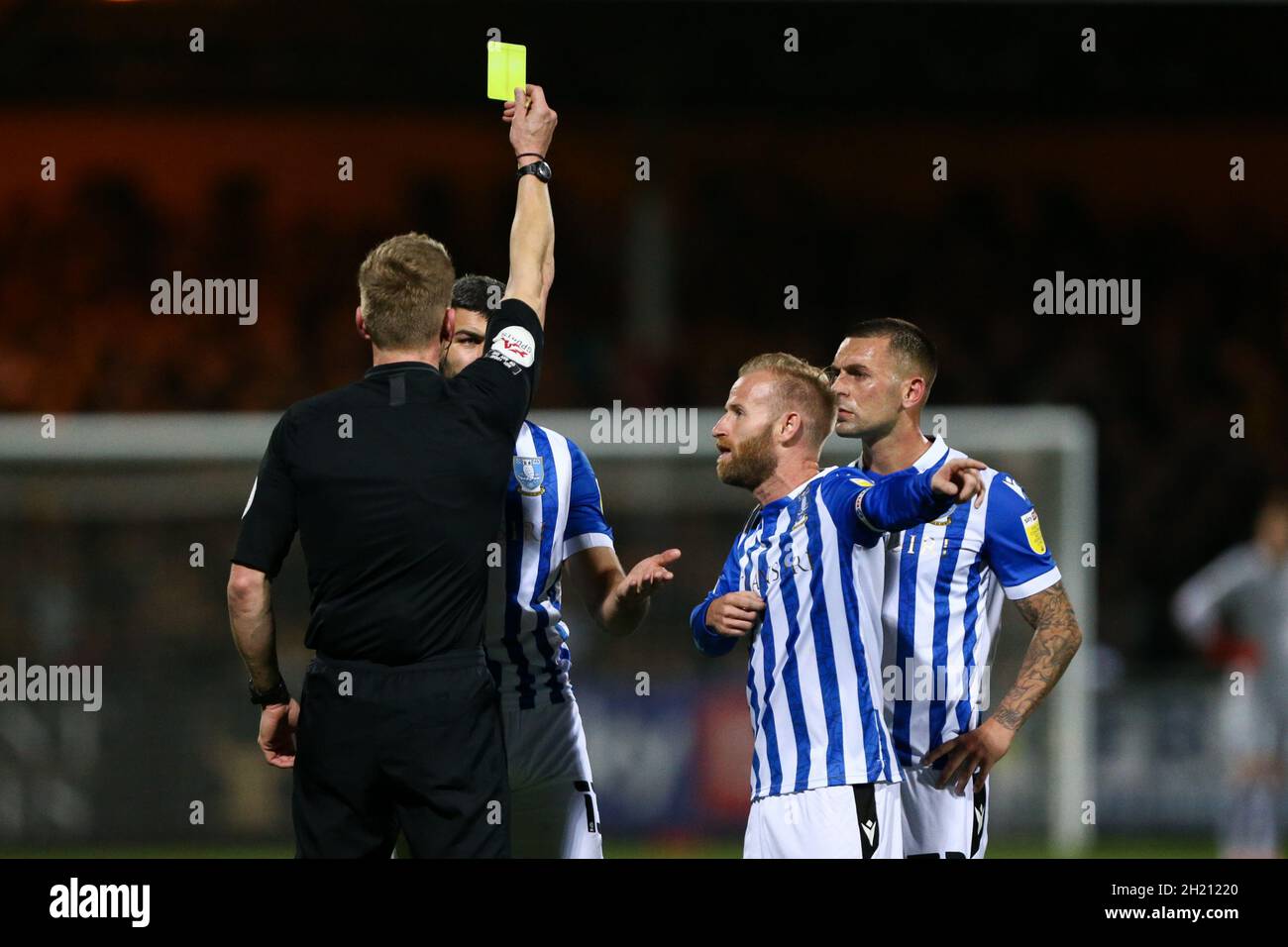 Callum Paterson #13 of Sheffield Wednesday is spoken to by the referee ...