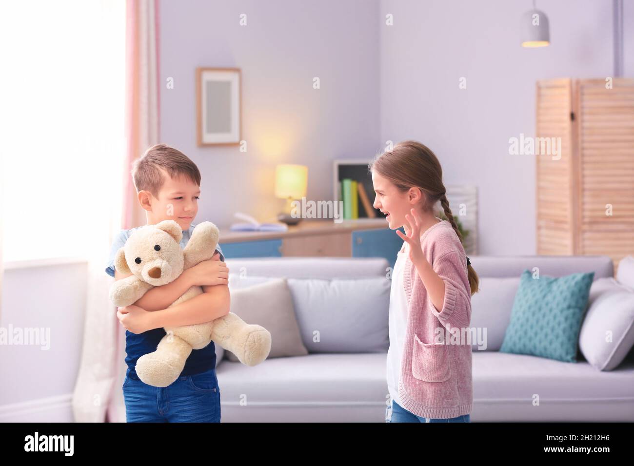 Brother arguing with sister at home Stock Photo - Alamy