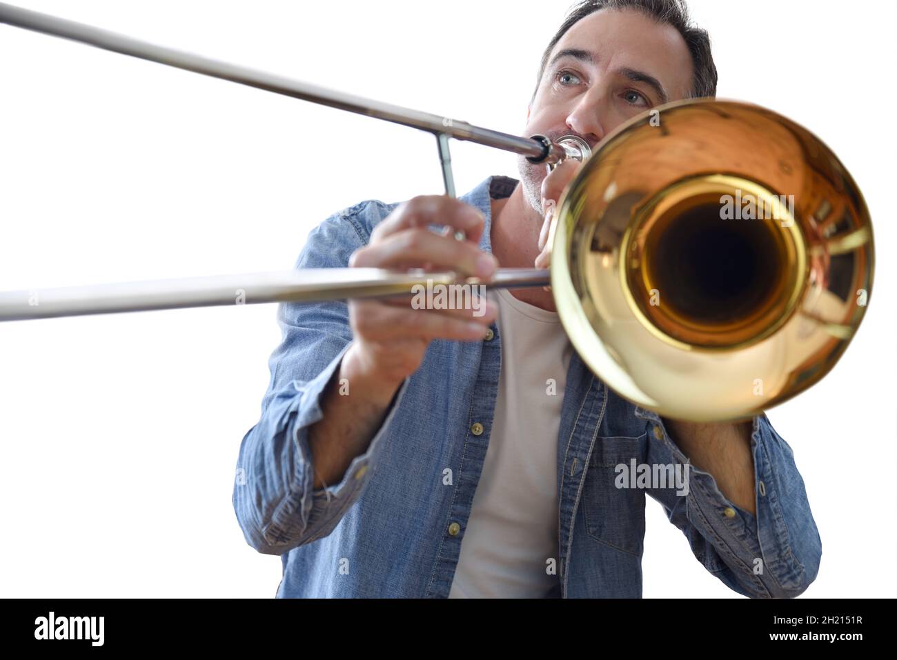Detail of man playing trombone with white isolated background. Front ...