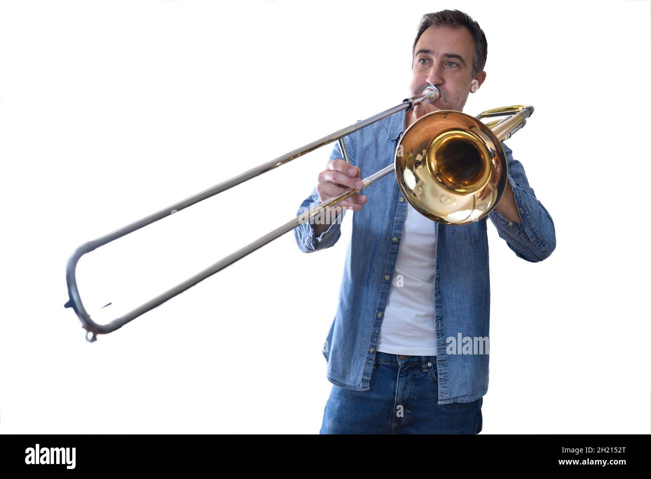 Trombonist playing trombone with white isolated background. Horizontal ...