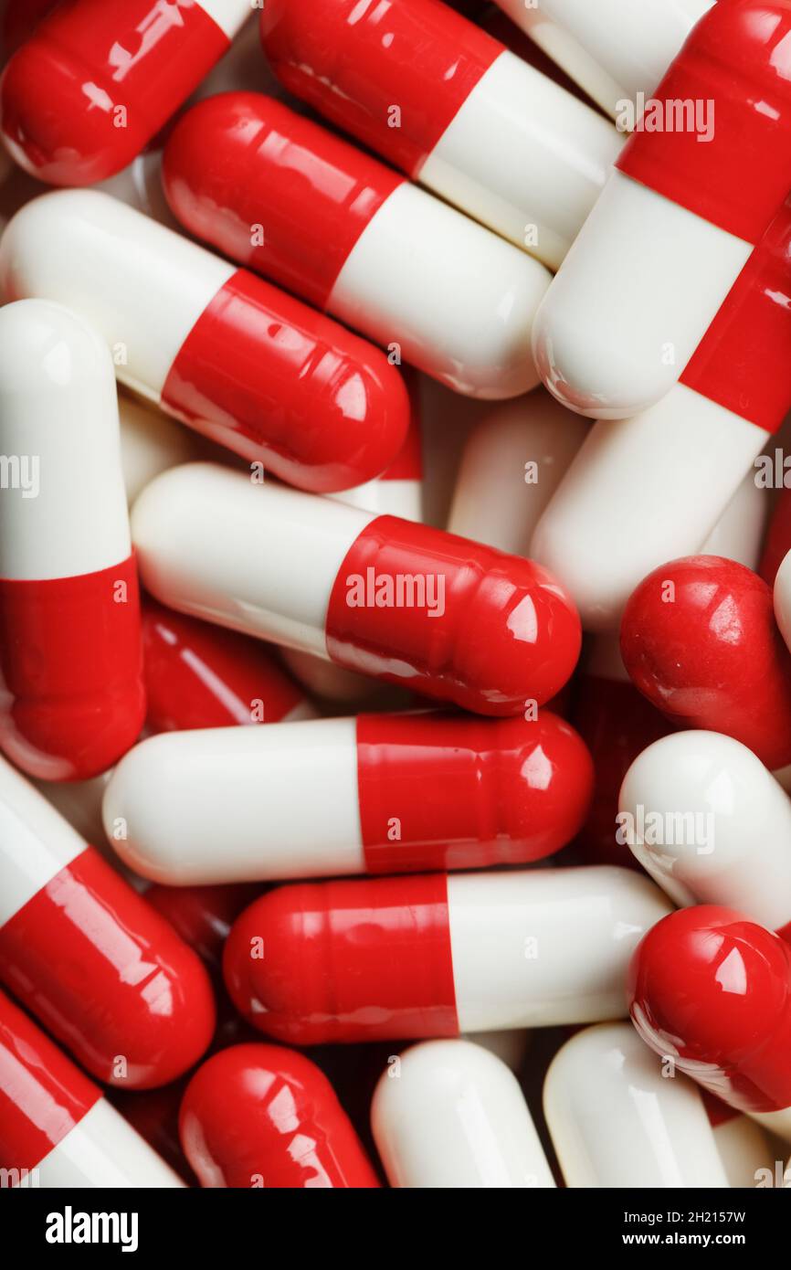 Medical medicinal Pills capsules are white and red in color as a ...