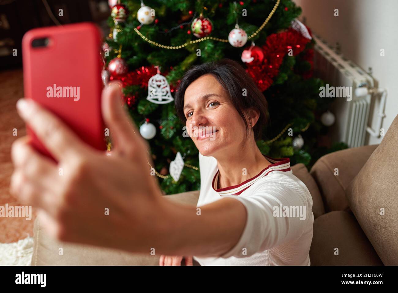 Woman taking photo christmas hi-res stock photography and images - Alamy
