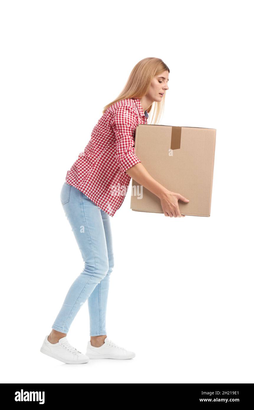 Full length portrait of woman lifting carton box on white background ...
