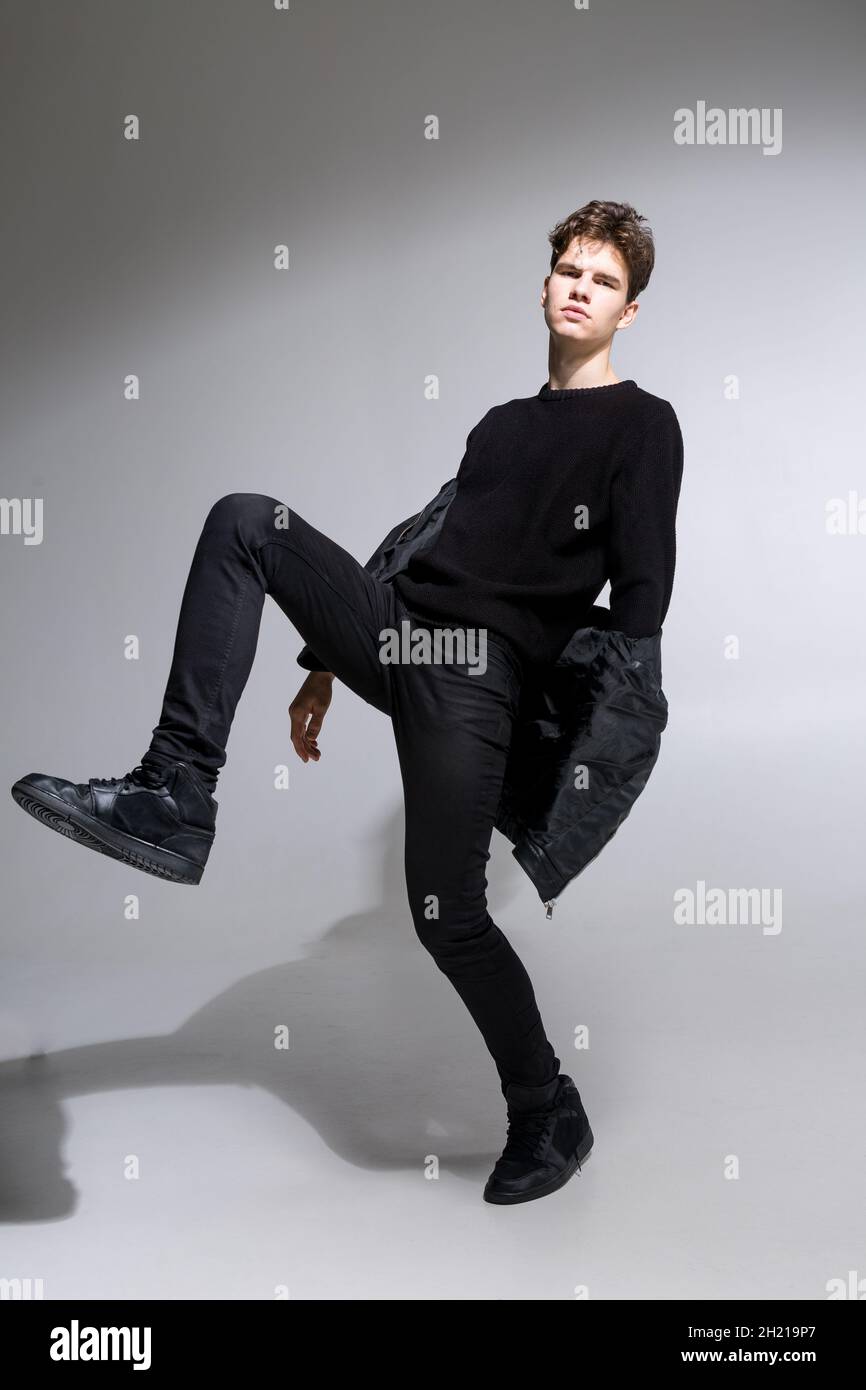 Full body image of model appearance of young fashionable guy in leather ...