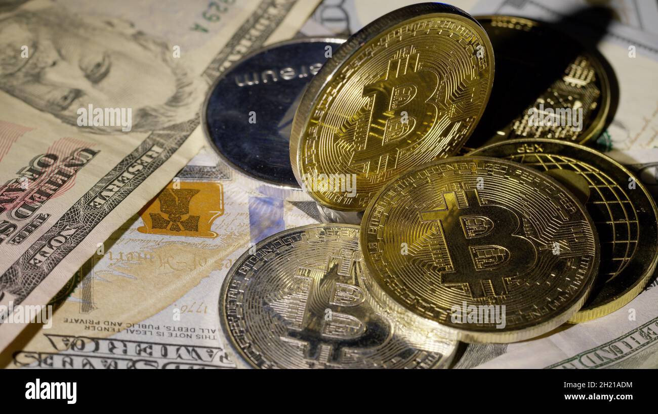 Bitcoin BTC coin and Ethereum ETH coins rotating on bills cash of 100 ...