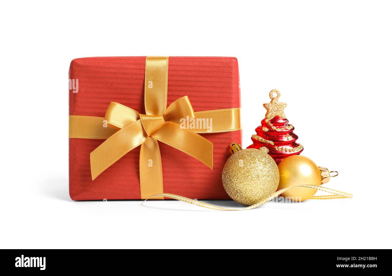 Beautifully wrapped gift box and decorations on white background Stock ...