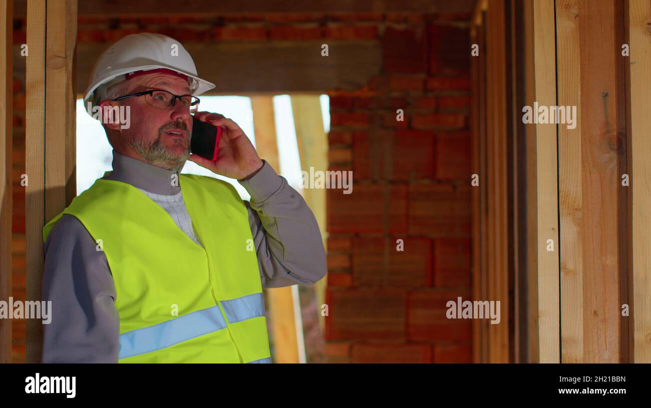 Architect engineer using mobile cell phone communications control ...