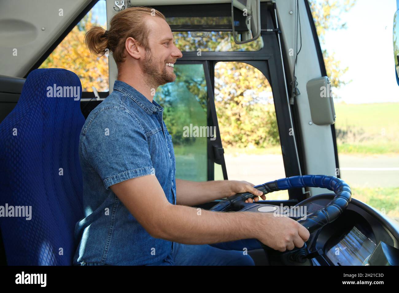 Professional bus driver at steering wheel. Passenger transportation ...