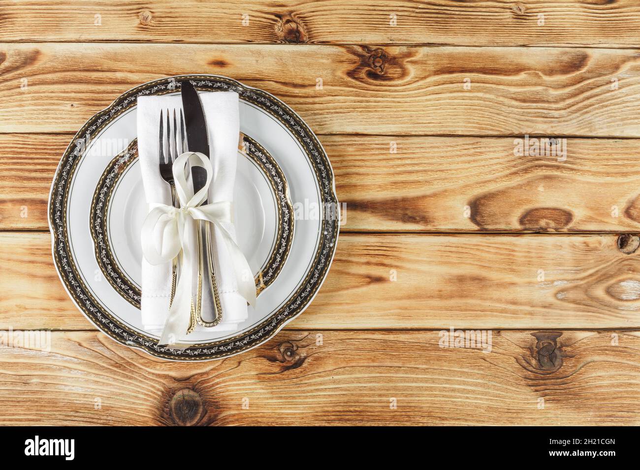 Beautiful table setting on wooden table from above Stock Photo - Alamy