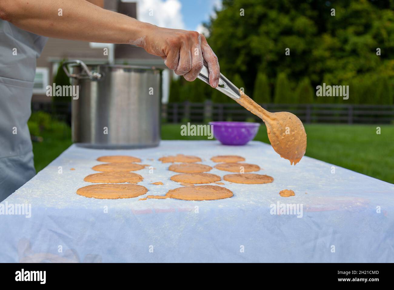 Tarhana soup is a traditional Turkish soup made from powder. A woman is ...
