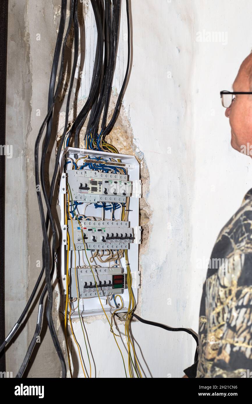 Russia, Anapa-07.11.2020: An electrician assembles wires to an ...