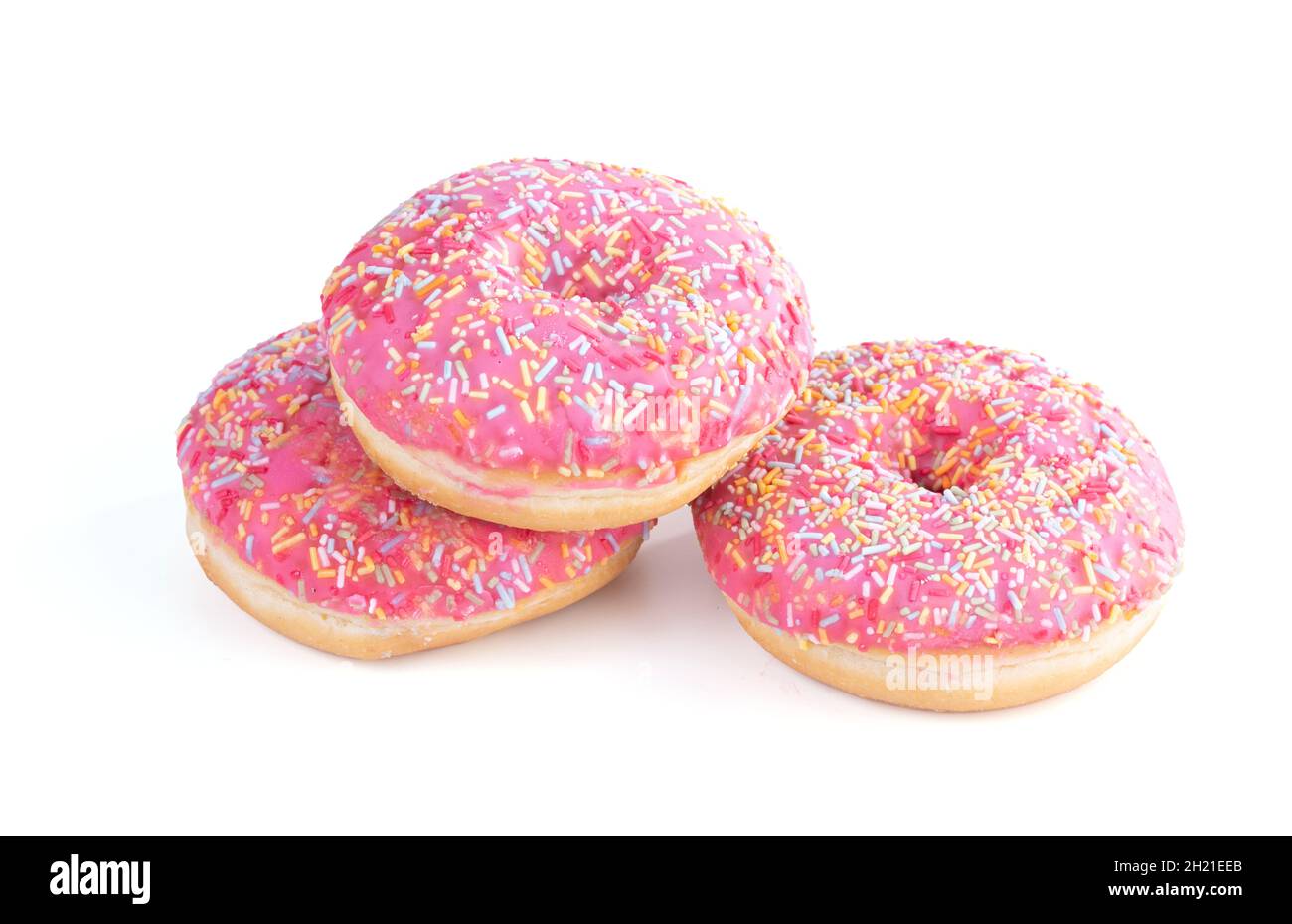 Three pink donuts with small candies on a white background Stock Photo ...