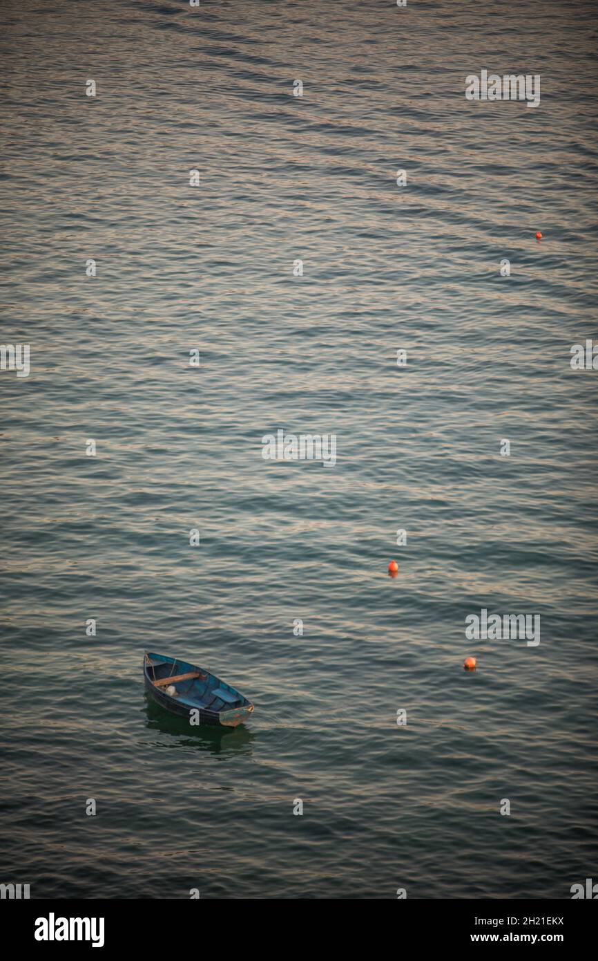 High angle image of a empty wooden boat floating on water Stock Photo ...