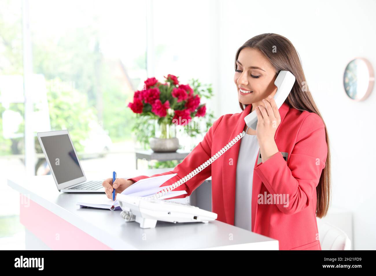 Salon receptionist computer hi-res stock photography and images - Alamy