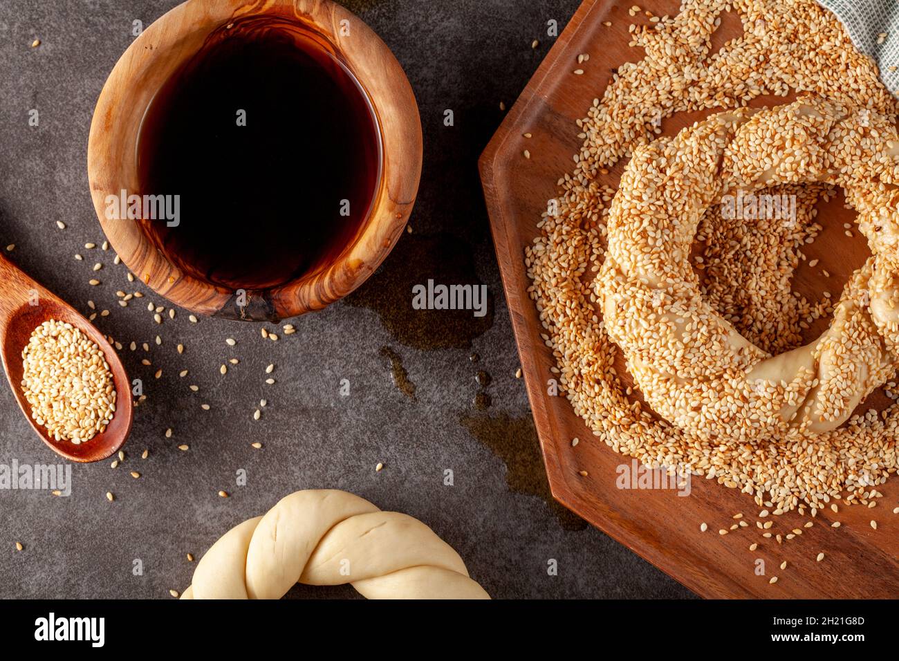 delicious Turkish bagel with sesame seeds known as susamli simit. Woman ...