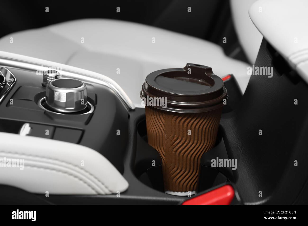 Takeaway paper coffee cup in holder inside car Stock Photo - Alamy