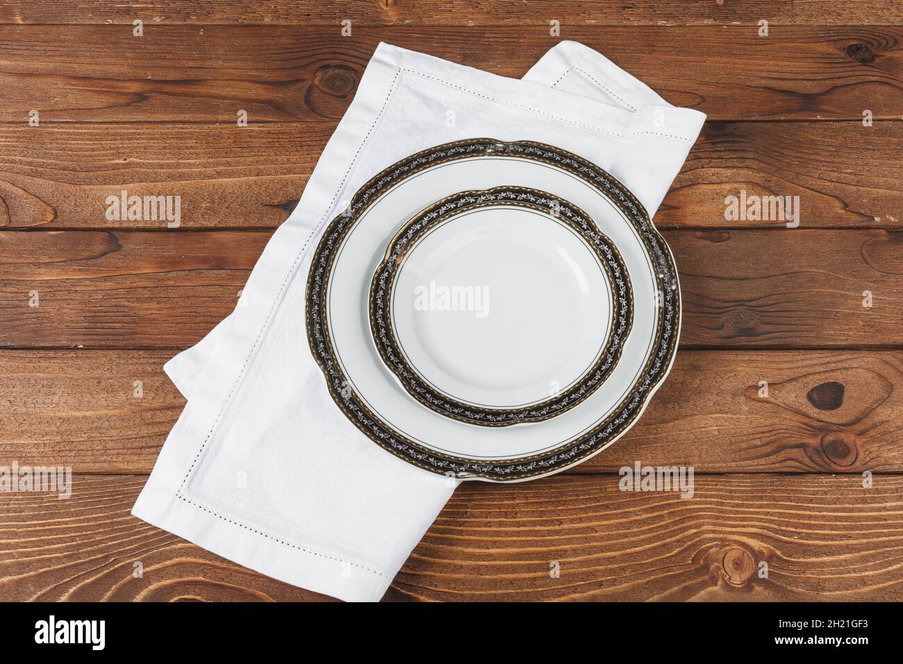 Table with plates and cutlery, view from above Stock Photo - Alamy