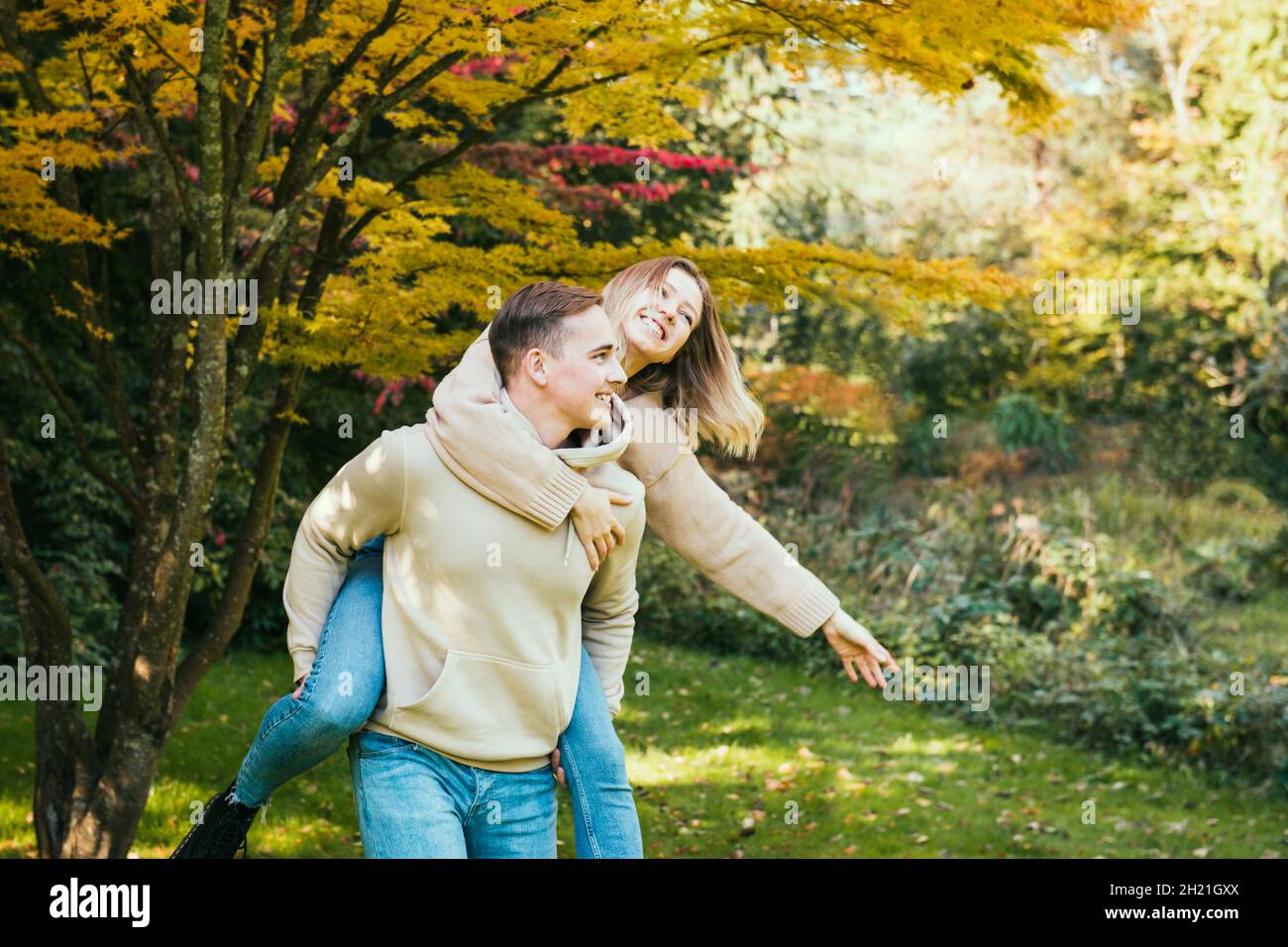 Young caucasian couple in love having fun during a walk in nature ...