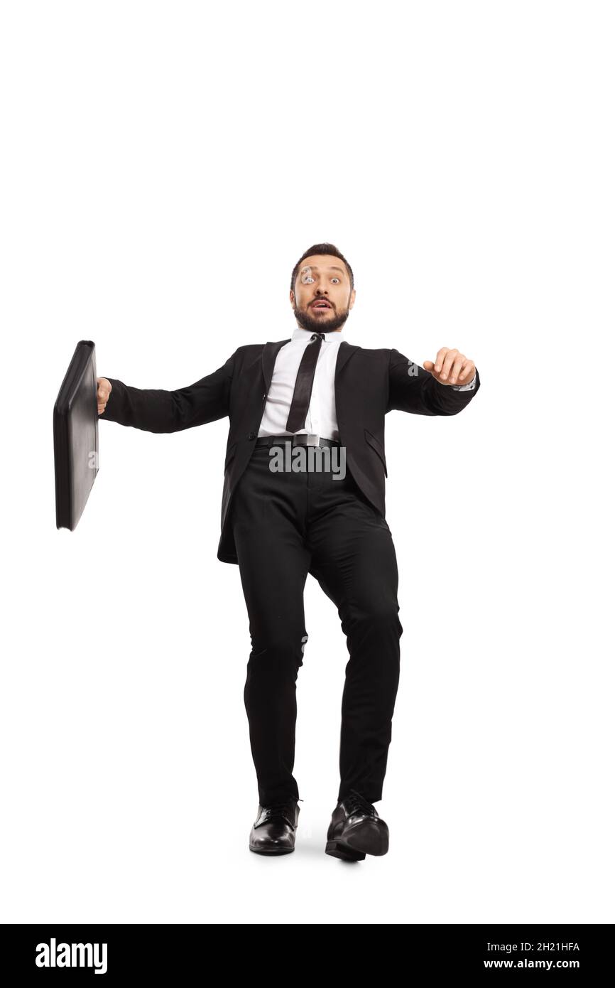 Full length portrait of a shocked businessman with a briefcase falling ...