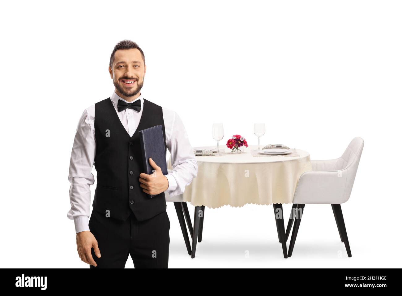 Waiter holding a menu list and standing in front of a table isolated on ...