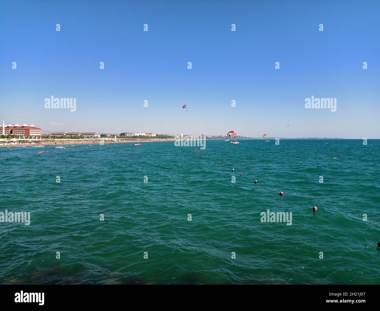 Beautiful view of the wavy sea gleaming under the blue sky Stock Photo ...