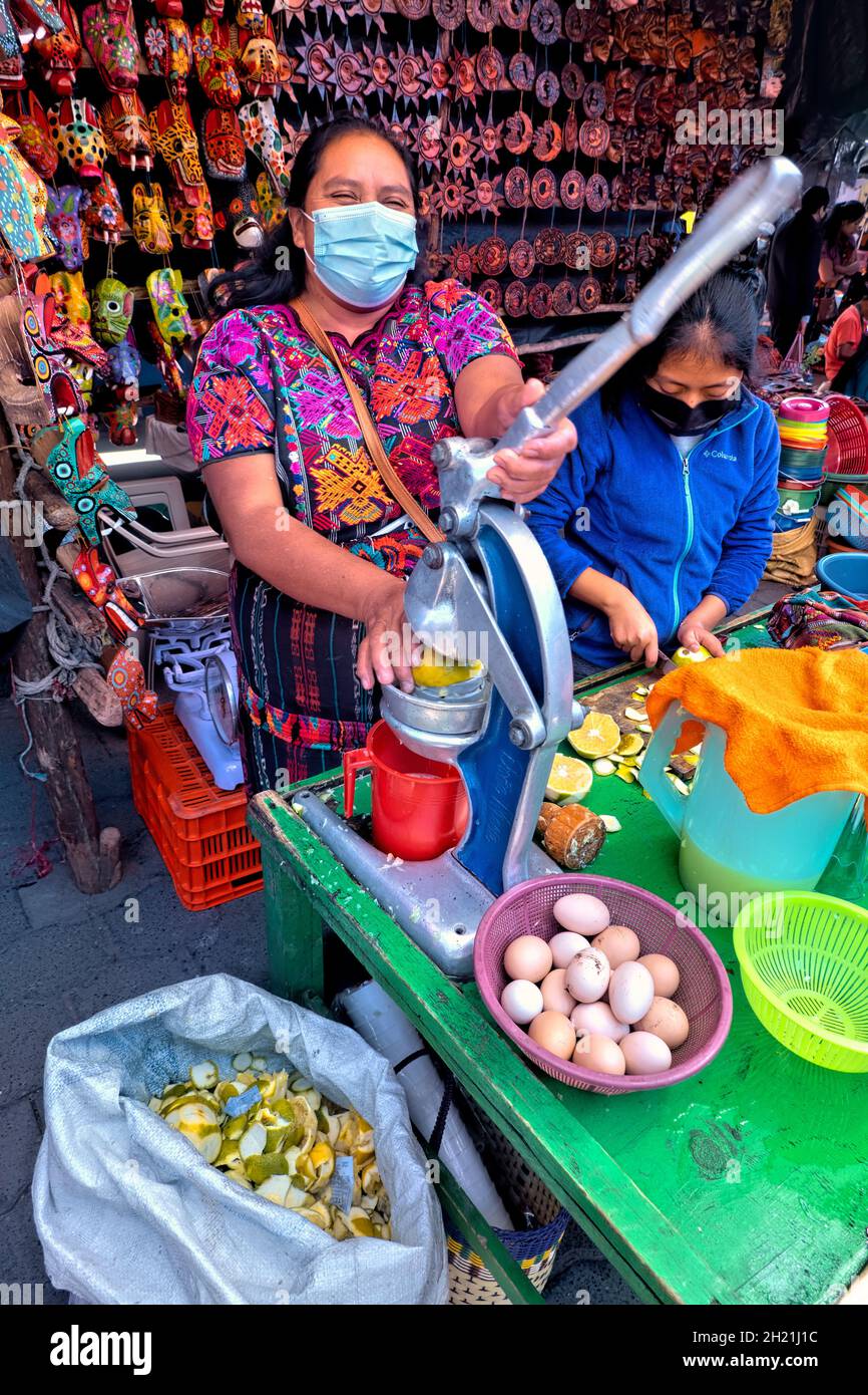 Orange juice seller at the Sunday Market in Chichicastenango, Guatemala ...