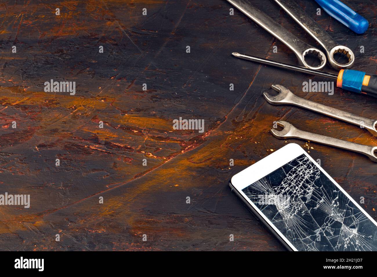 Digital gadget with tools. Repairing smartphone concept Stock Photo - Alamy