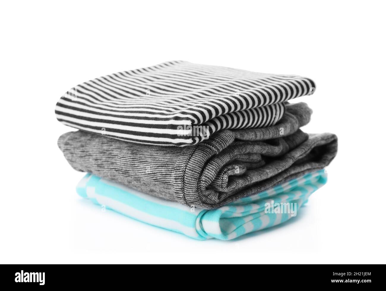 Stack of folded child clothes isolated on white Stock Photo - Alamy