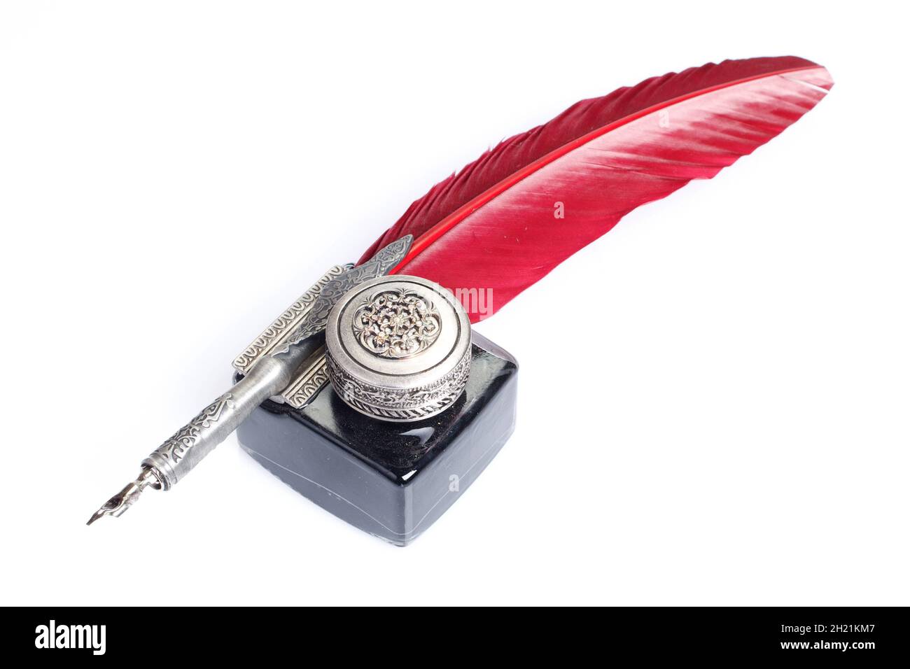 Old vintage red fountain pen with inkwell on white background Stock ...