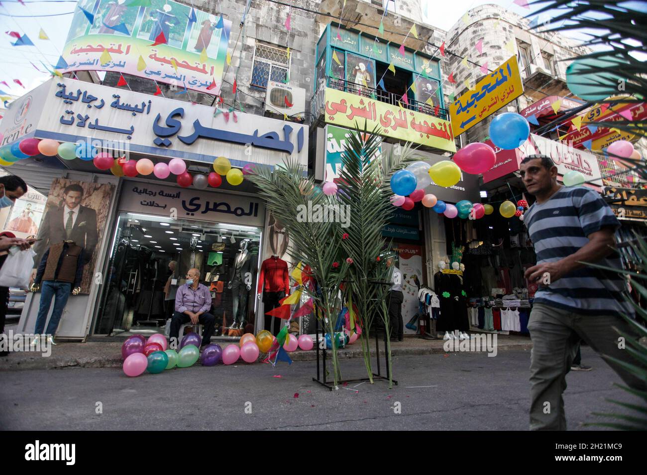 Nablus, Palestine. 19th Oct, 2021. View of a decorated street with palm ...