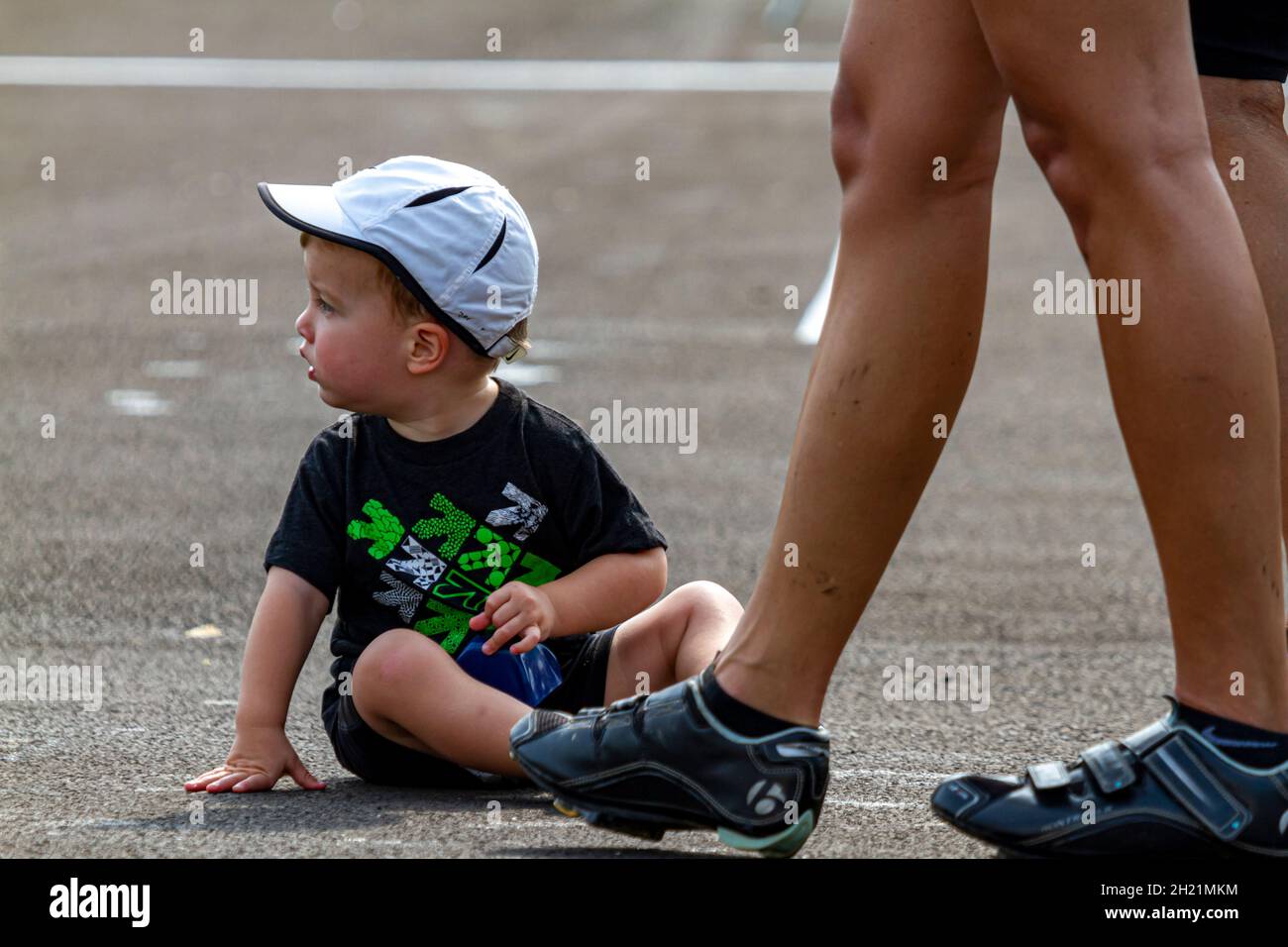 Boy touching legs hi-res stock photography and images - Alamy