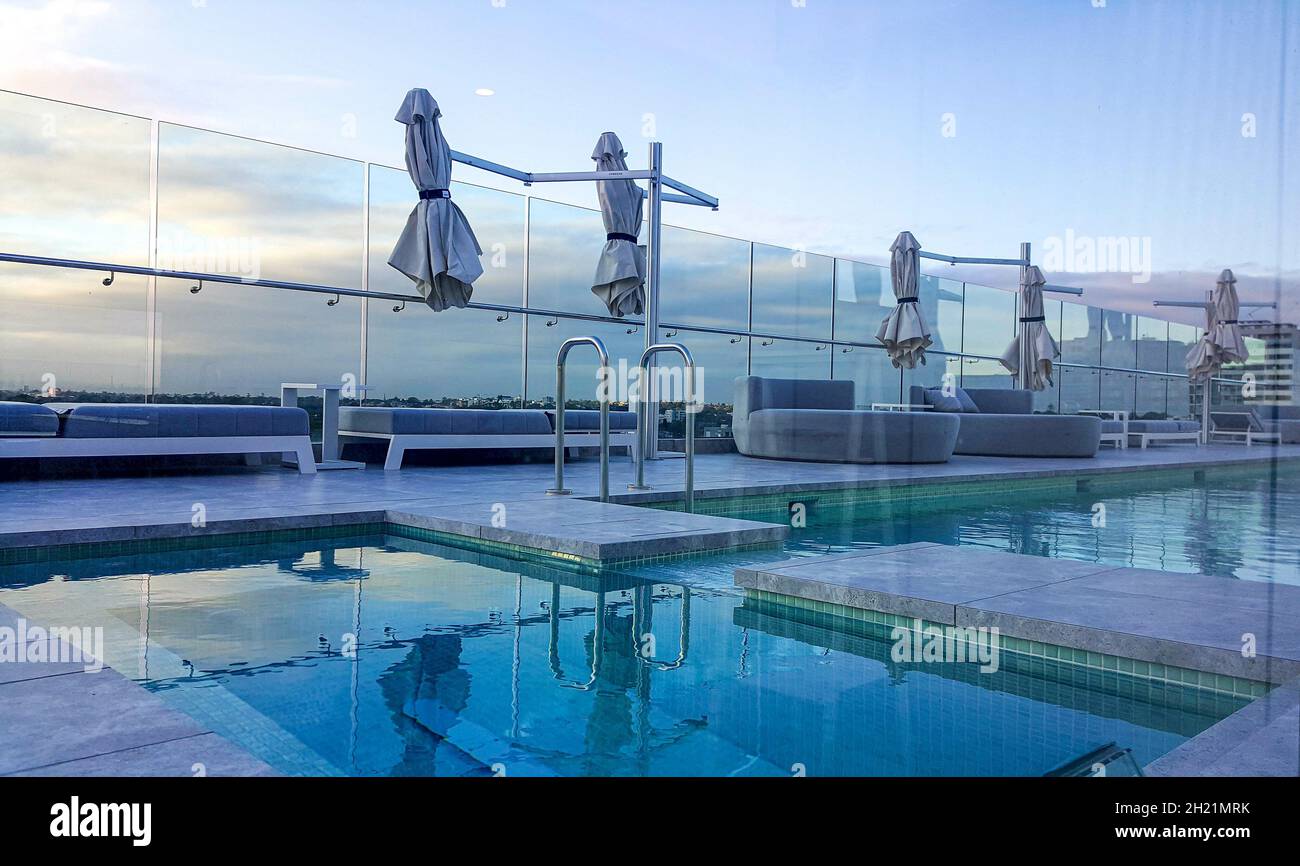 Swimming pool on a rooftop of a building in the evening Stock Photo - Alamy