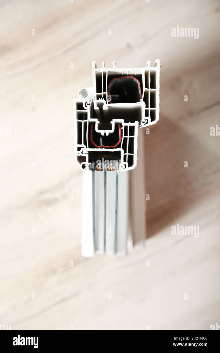 Sample of modern window profile on wooden background, top view ...