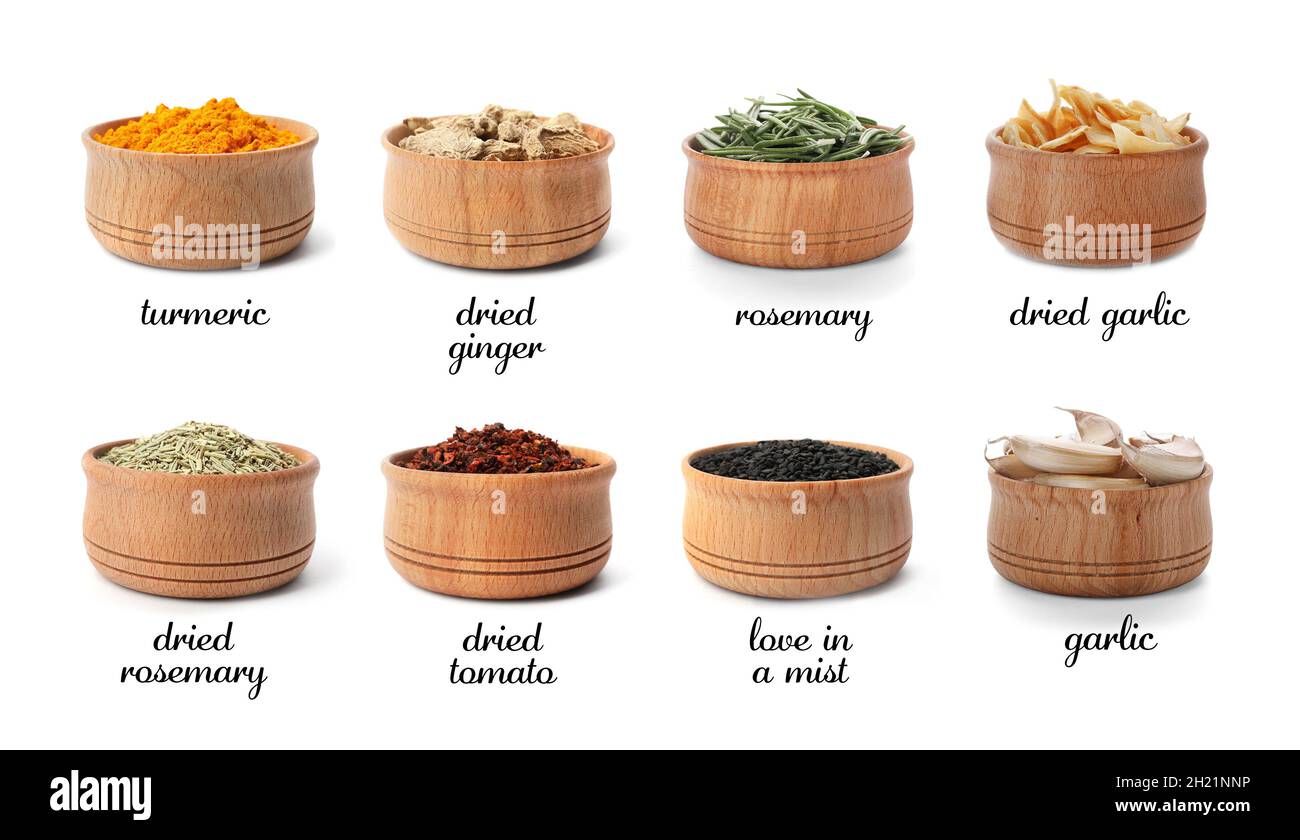 Wooden bowls with different spices and herbs on white background. Large ...