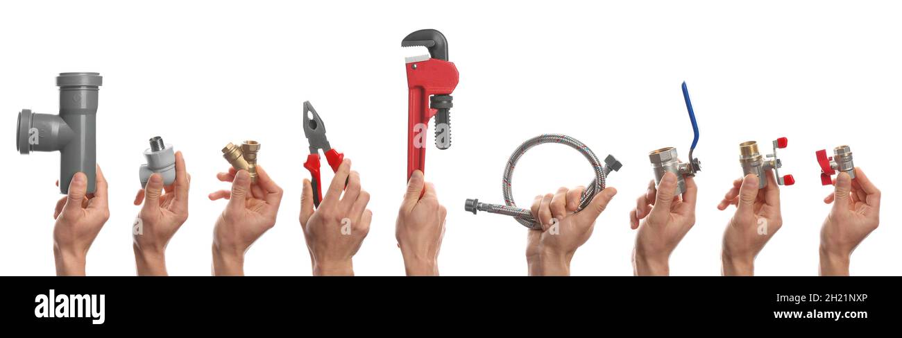 Plumbers holding different tools and fittings on white background Stock ...