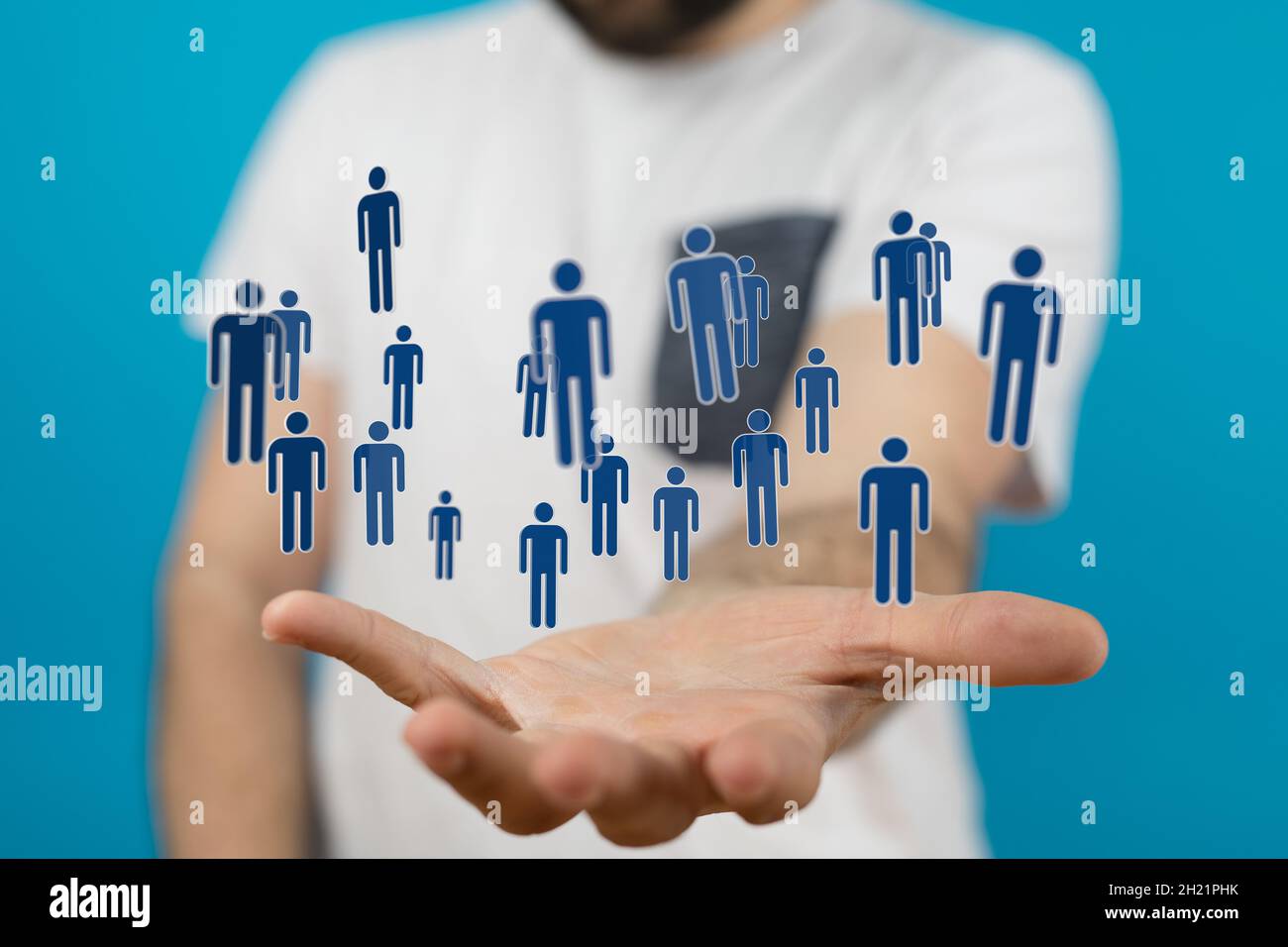 3D rendered people icons hovering over the person's hand Stock Photo ...