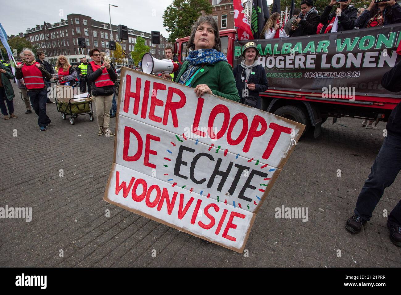 Rotterdam, Netherlands. 17th Oct, 2021. A protester holds a placard ...