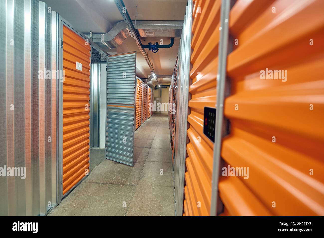Open door in modern storage boxes in warehouse Stock Photo - Alamy