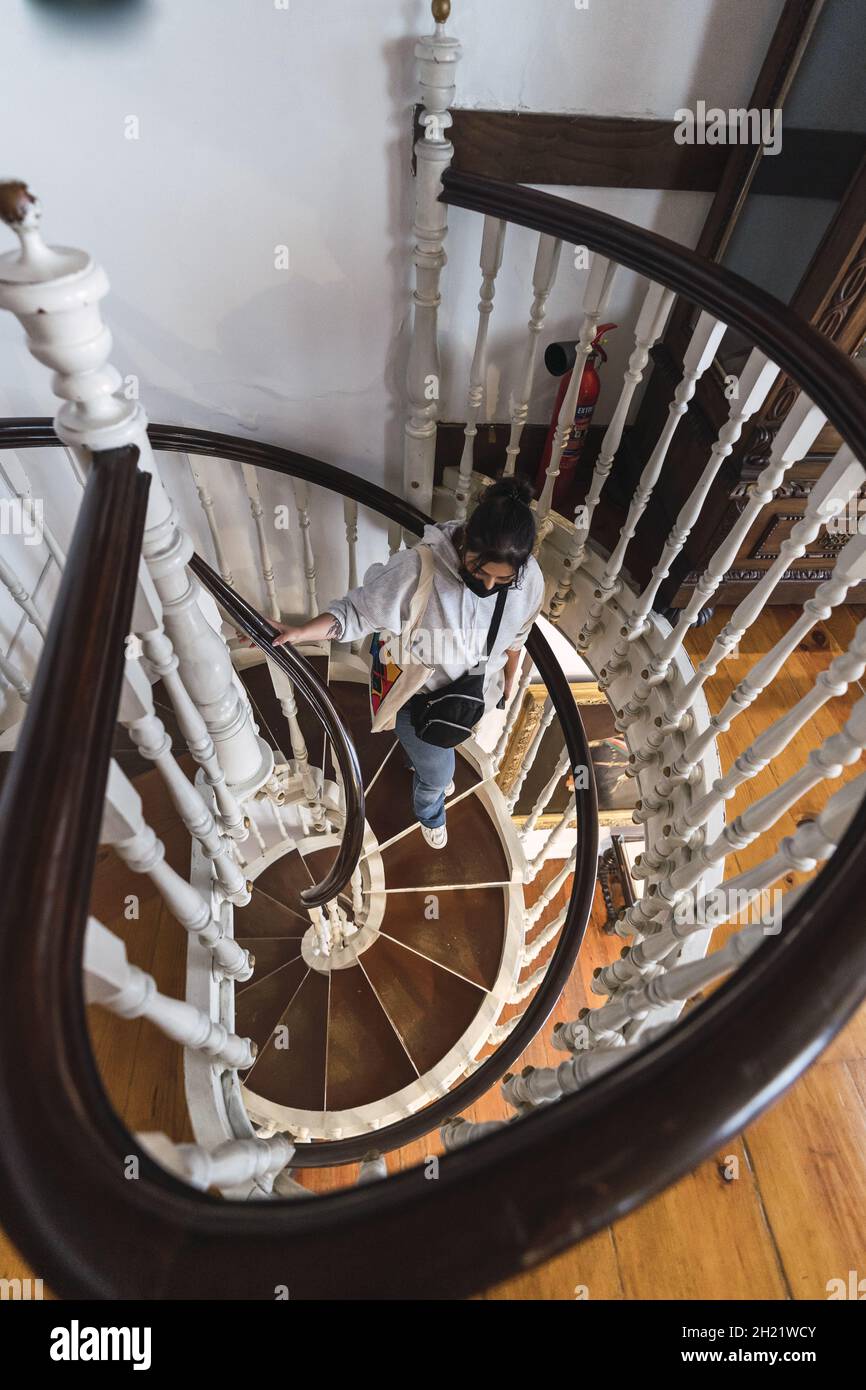 Woman going down stairs girl hi-res stock photography and images - Alamy