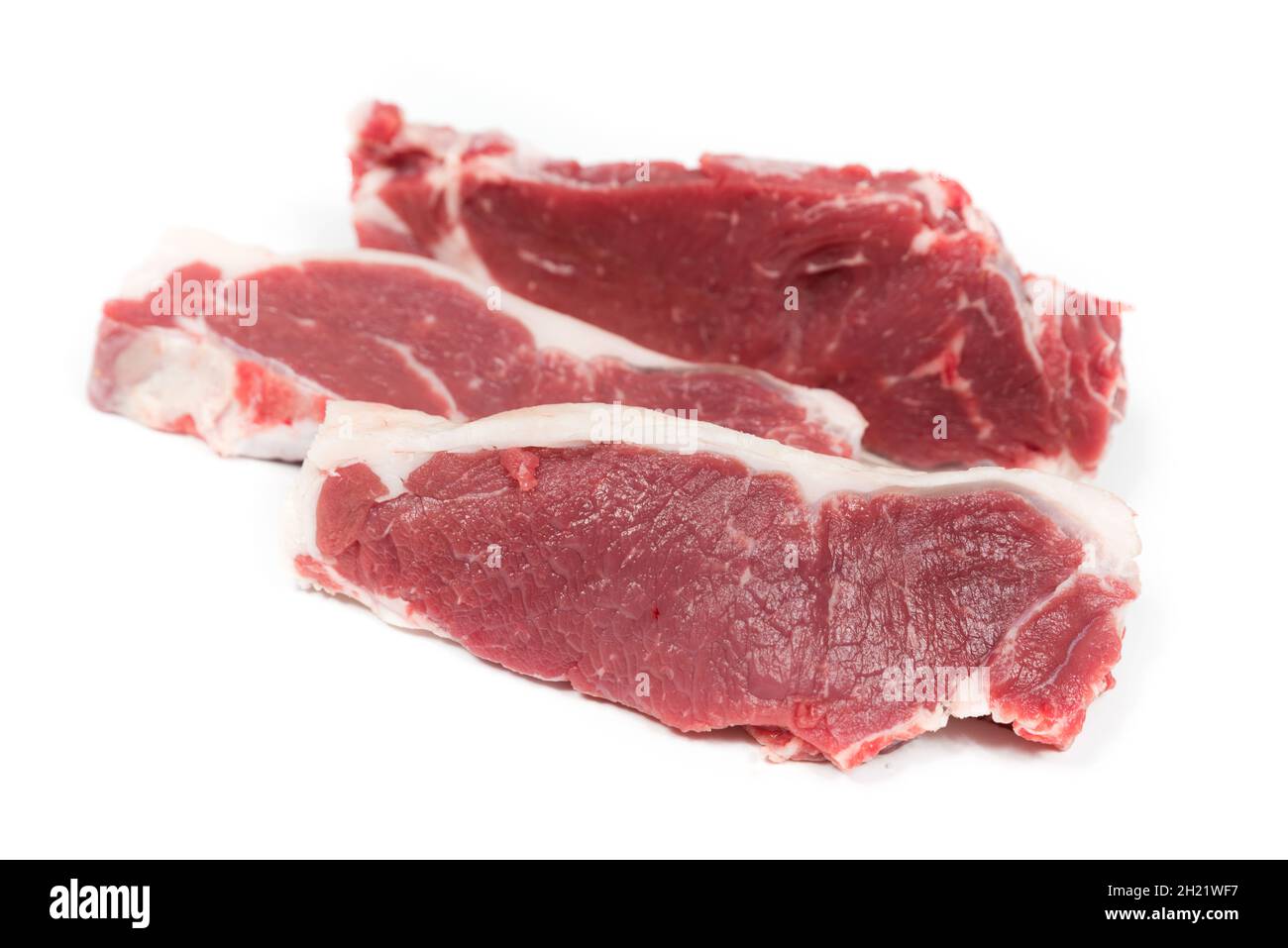 Beef slices on a perfect white background Stock Photo - Alamy