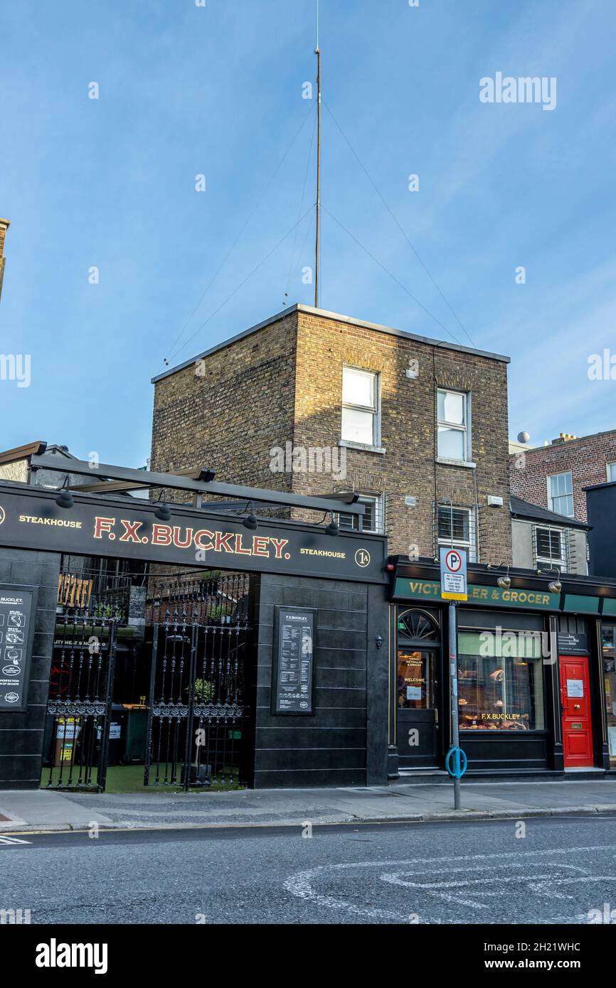 DUBLIN, IRELAND - Apr 23, 2021: A vertical shot of shops, restaurants ...