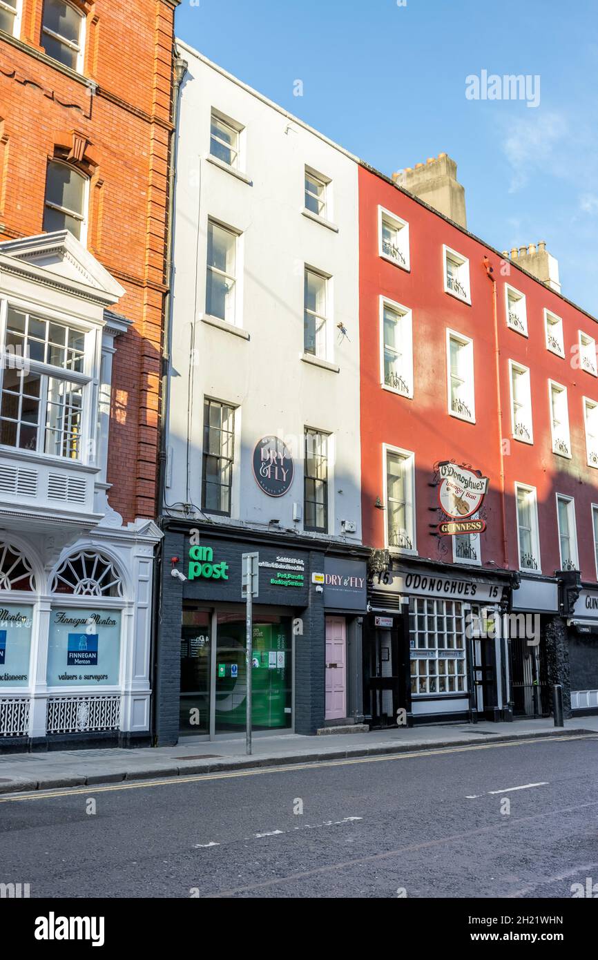 DUBLIN, IRELAND - Apr 23, 2021: A vertical shot of shops, and O ...