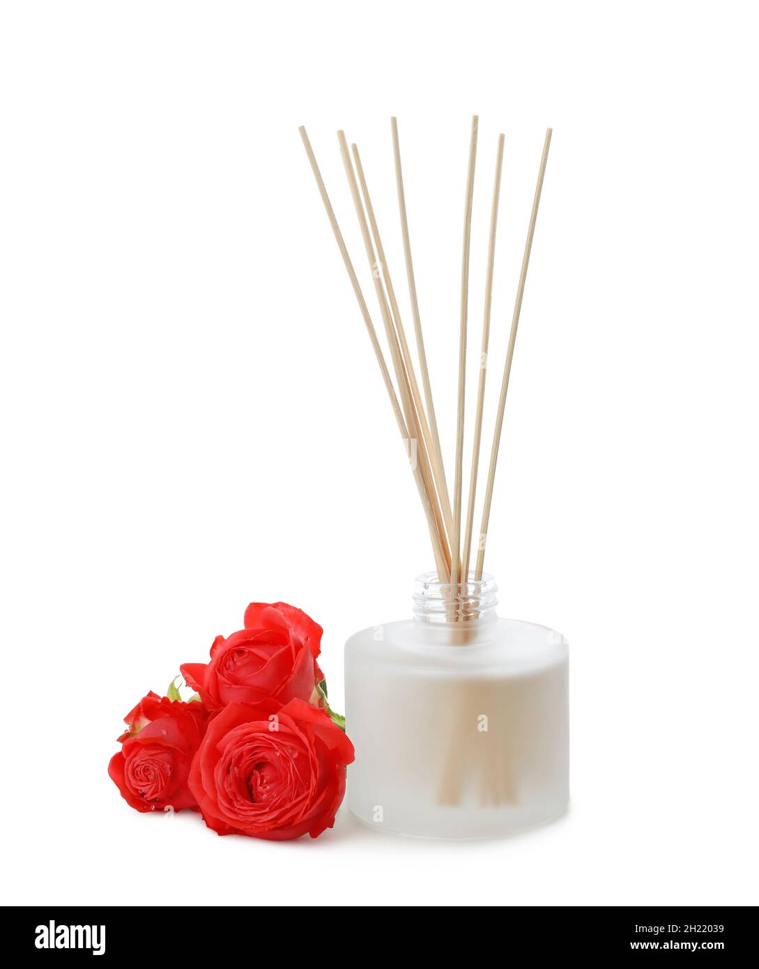 Aromatic reed freshener and roses on white background Stock Photo - Alamy