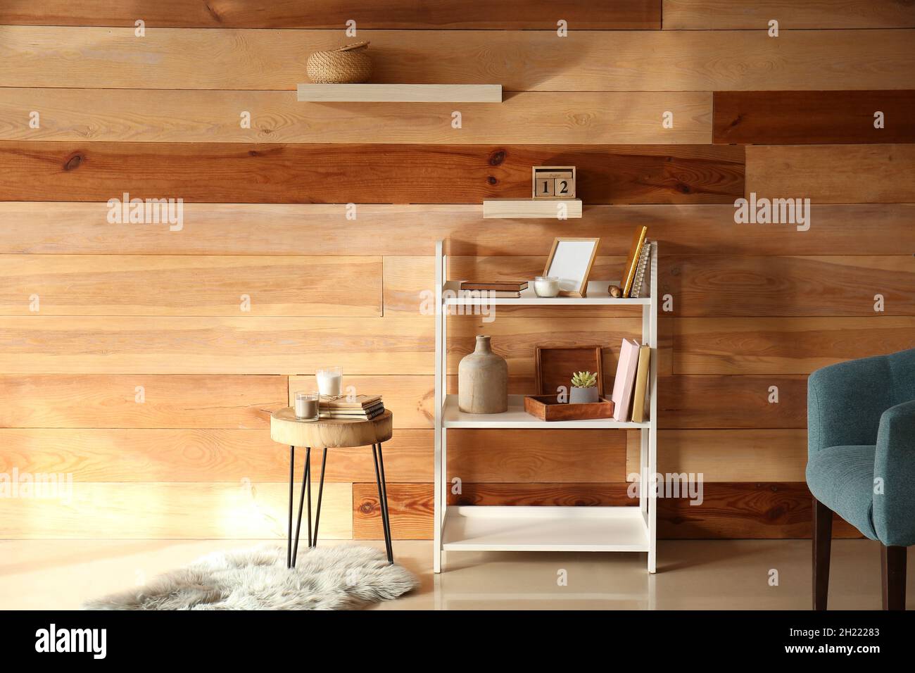 Stylish interior if room with rack, table and aroma candles Stock Photo ...